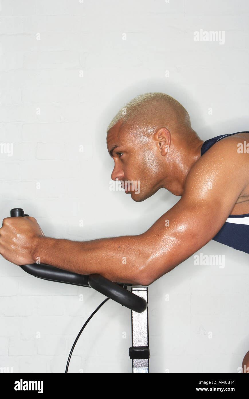 Man on Exercise Bicycle Stock Photo - Alamy
