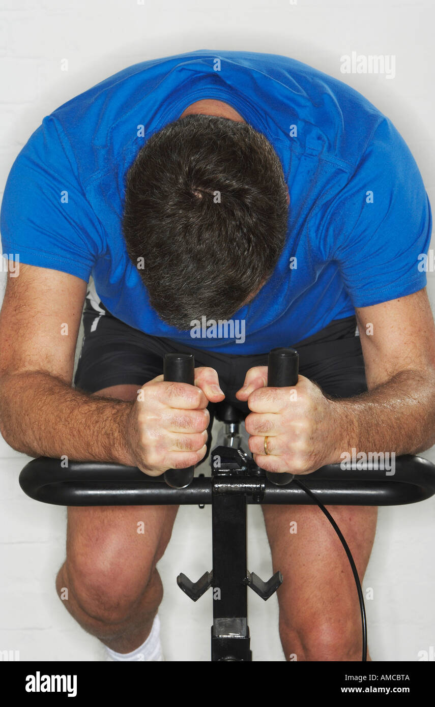 Man on Exercise Bicycle Stock Photo - Alamy