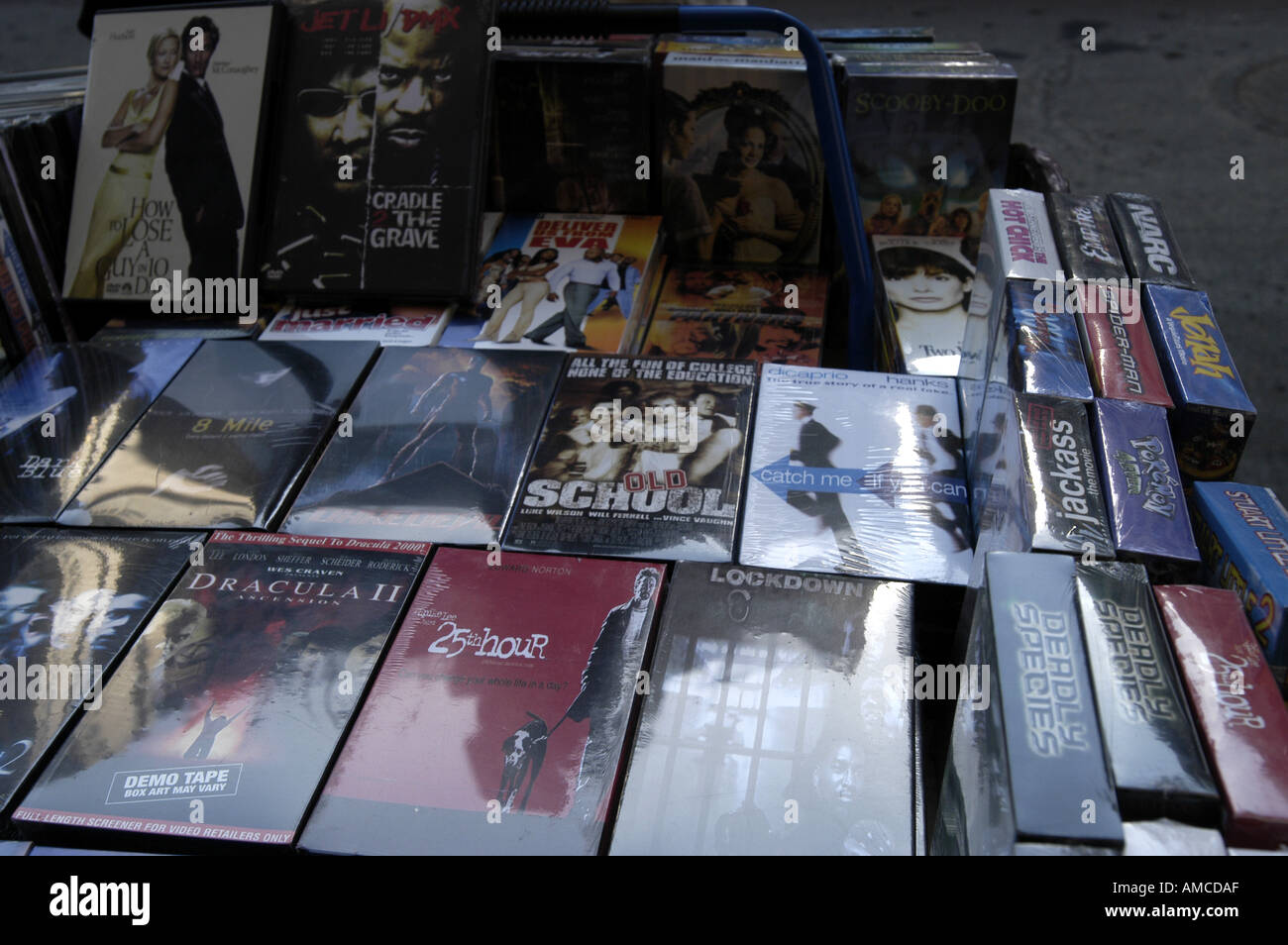 Books on outdoor display table reflecting light Stock Photo - Alamy