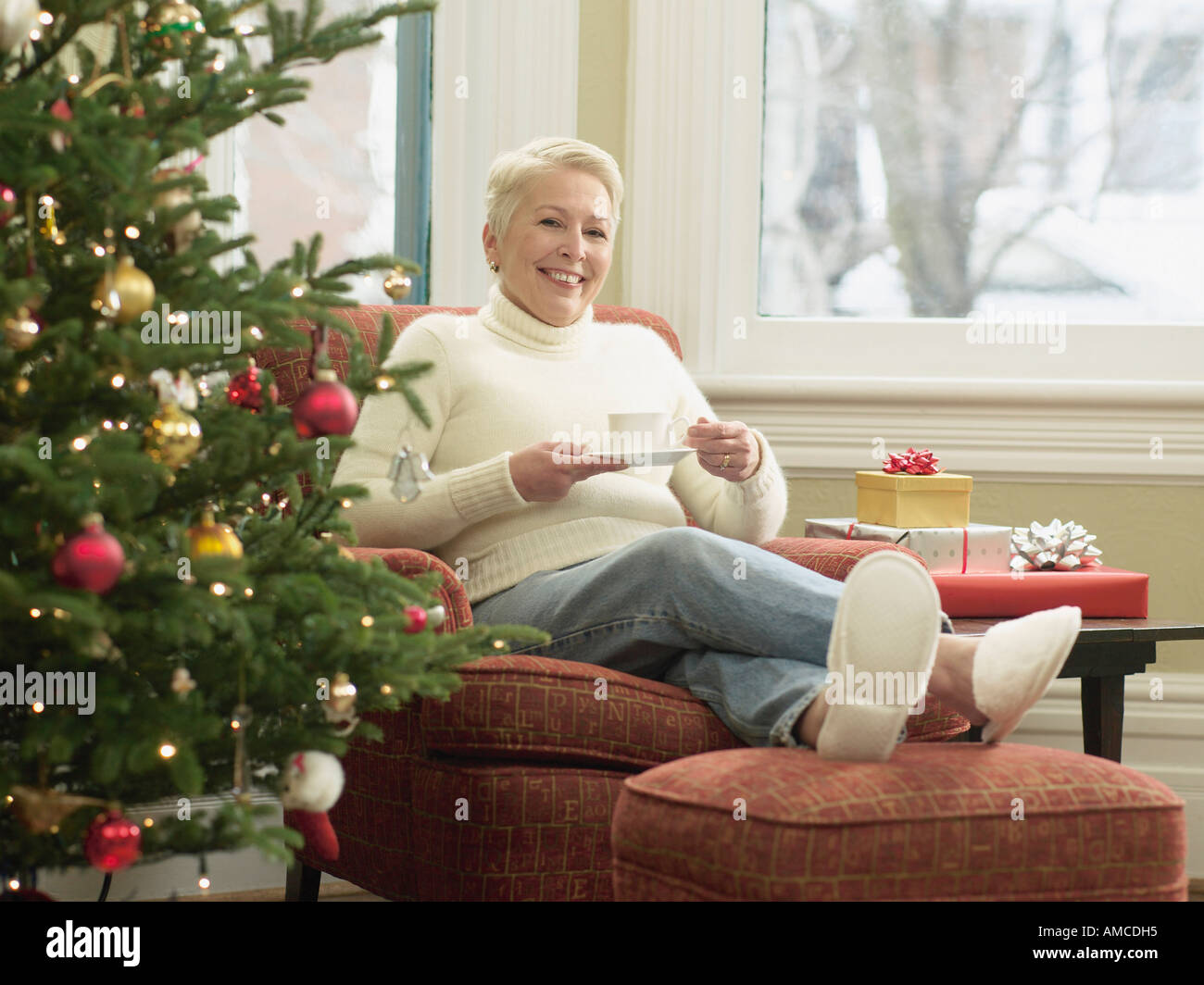 Joyful mature woman wrapped in hi-res stock photography and images - Alamy