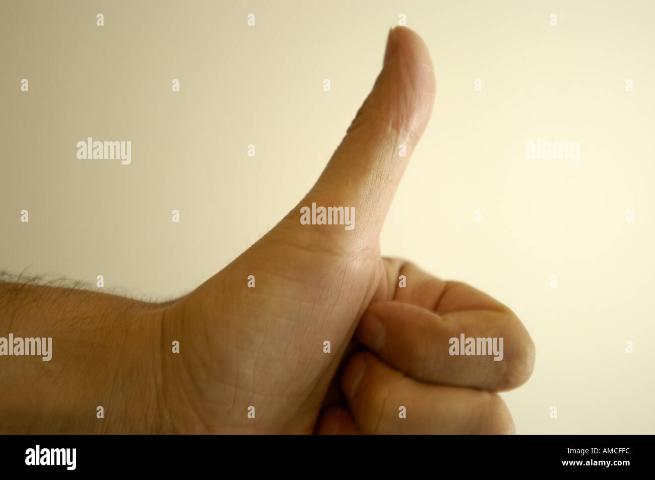 Hand giving thumbs up from left HORIZONTAL Stock Photo - Alamy