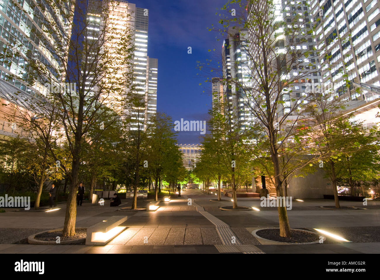 Evening view of modern office high rise buildings and landscaping at ...