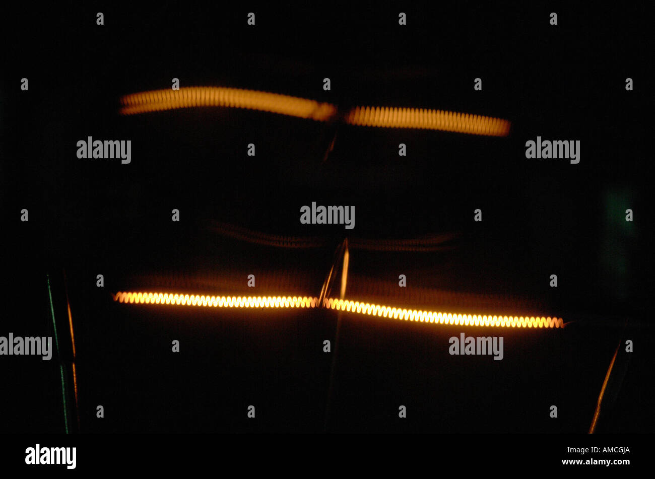 Glowing Tungsten Filament in Electric Light Bulb Stock Photo - Alamy