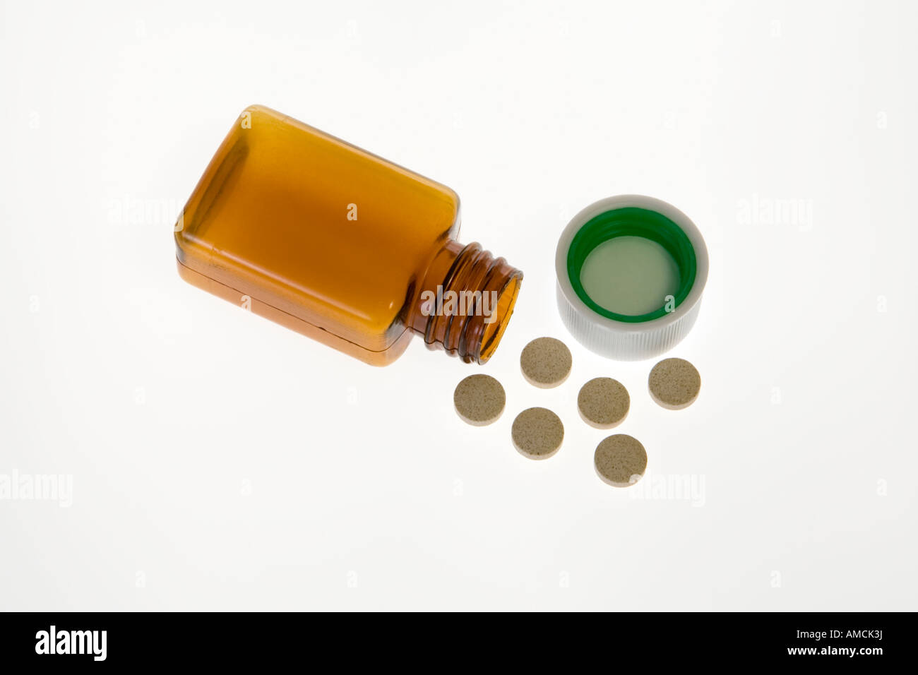 Pill bottle and pills top angle Stock Photo - Alamy
