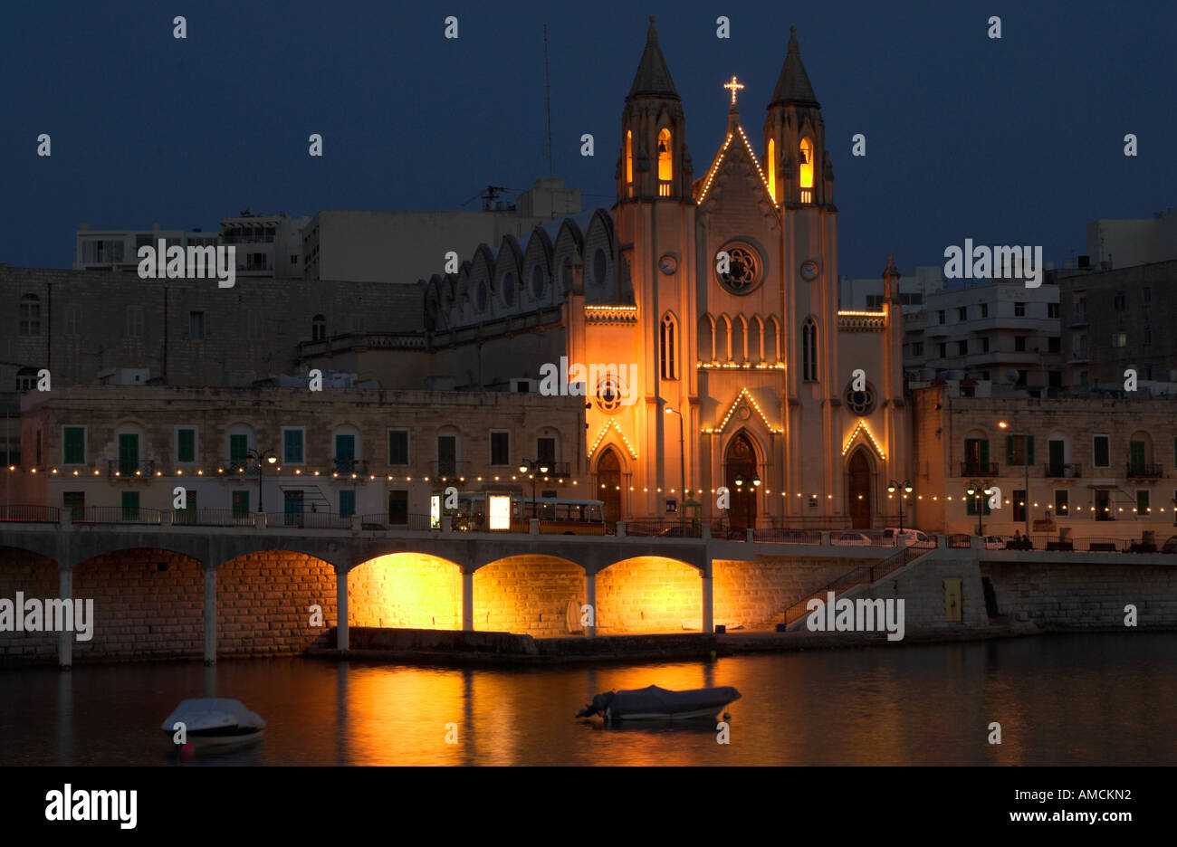 Church in Malta at dusk with lights lighting the building Stock Photo ...