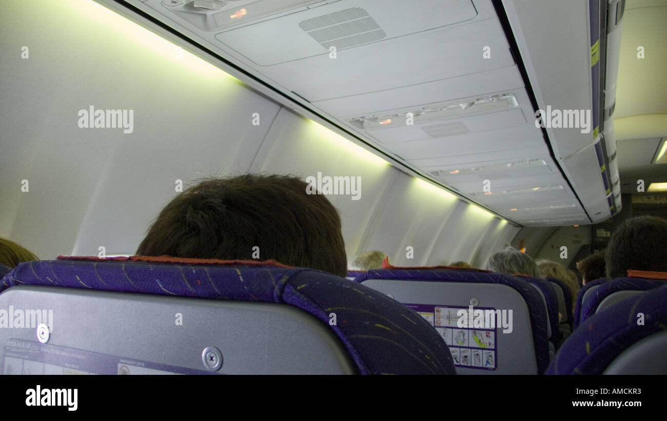 view down back of seats on aeroplane Stock Photo - Alamy