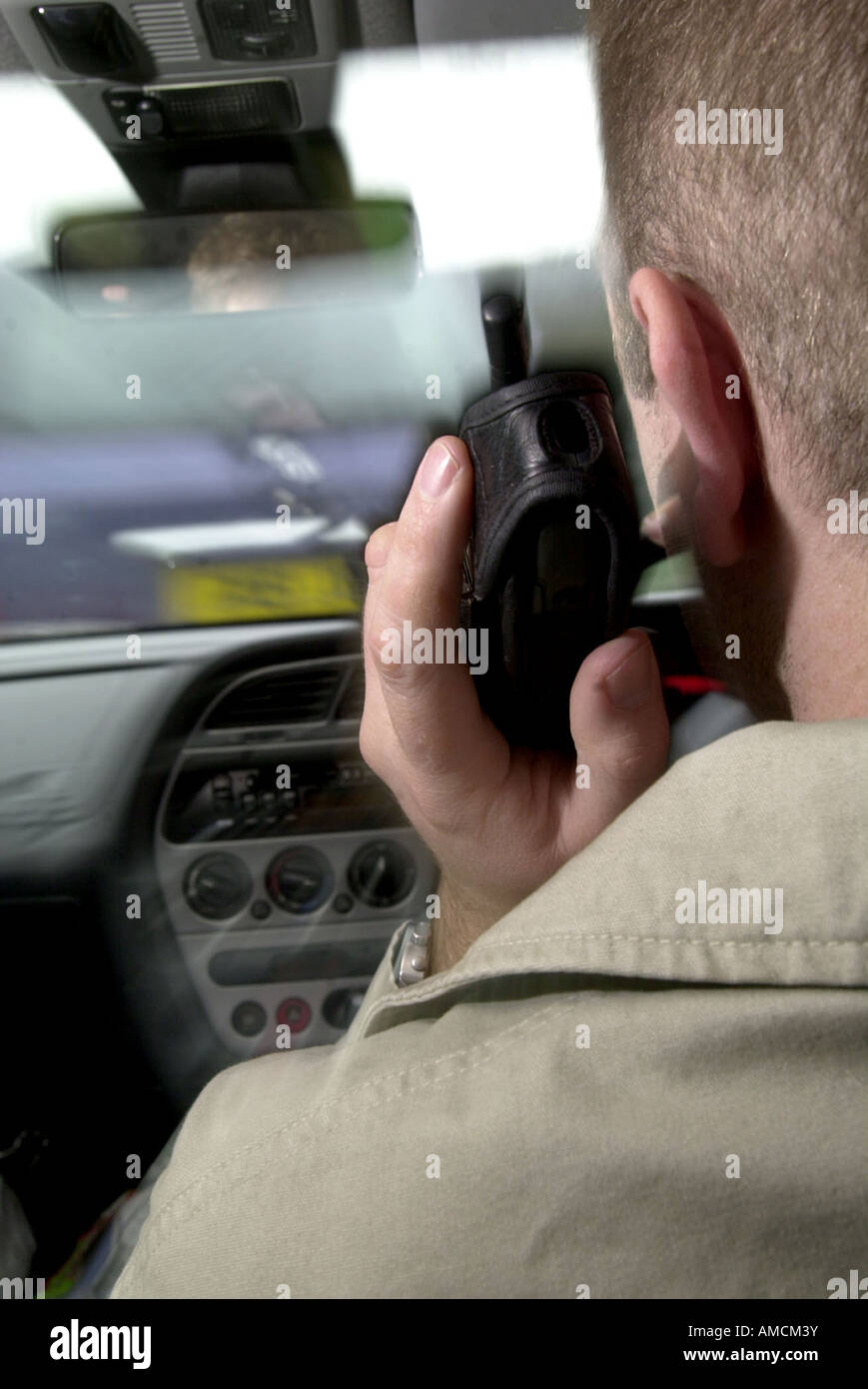 A CAR DRIVER USING A MOBILE PHONE UK Stock Photo - Alamy