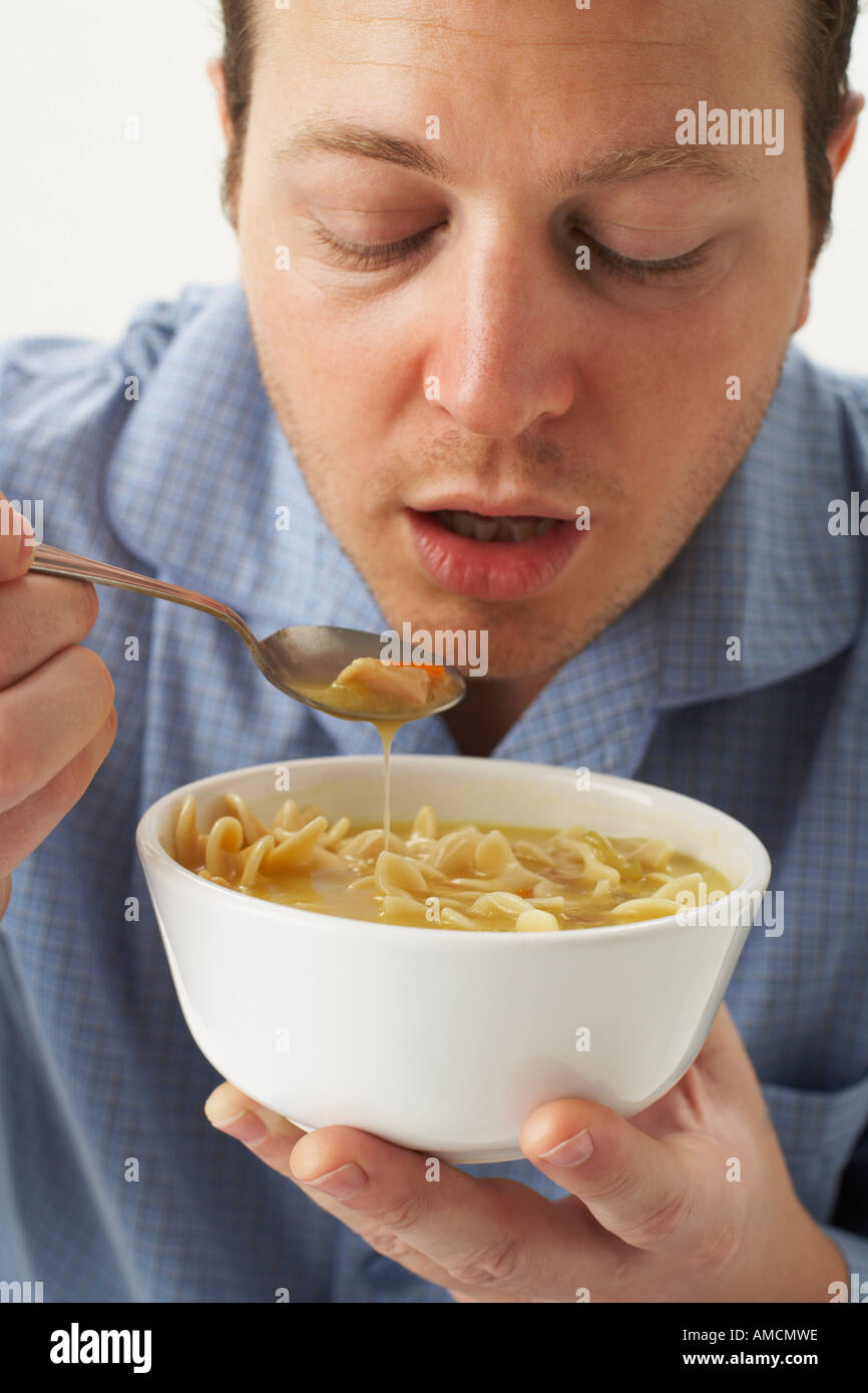 Sick man with chicken soup hi-res stock photography and images - Alamy