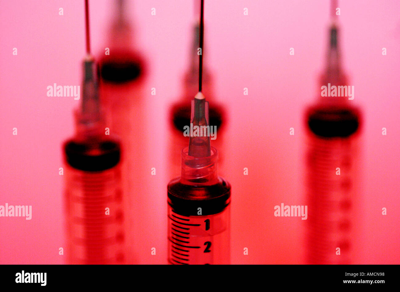 Coloured syringes hi-res stock photography and images - Alamy