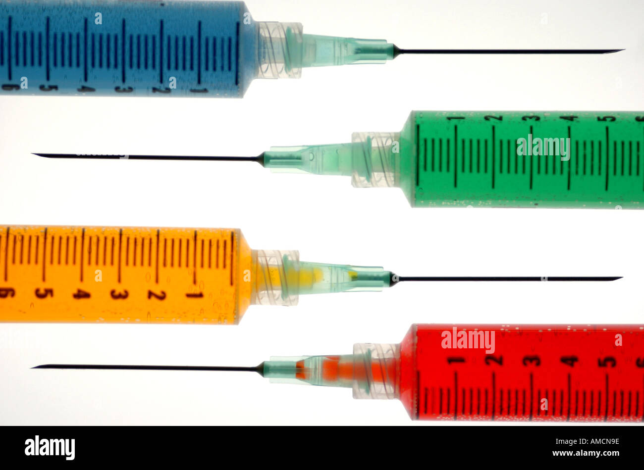Coloured syringes hi-res stock photography and images - Alamy