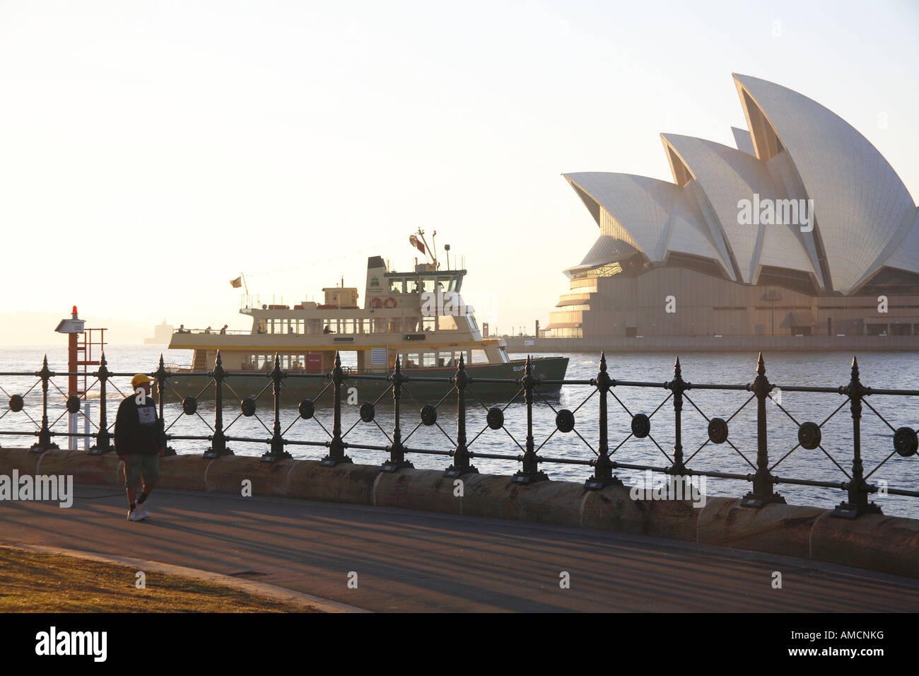 Sydney Harbour Ferry passing the Sydney Opera House on Bennelong Point ...