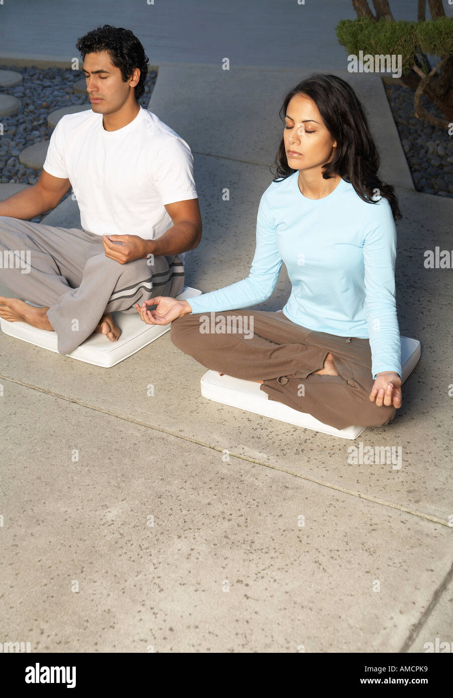 Couple Doing Yoga Stock Photo - Alamy