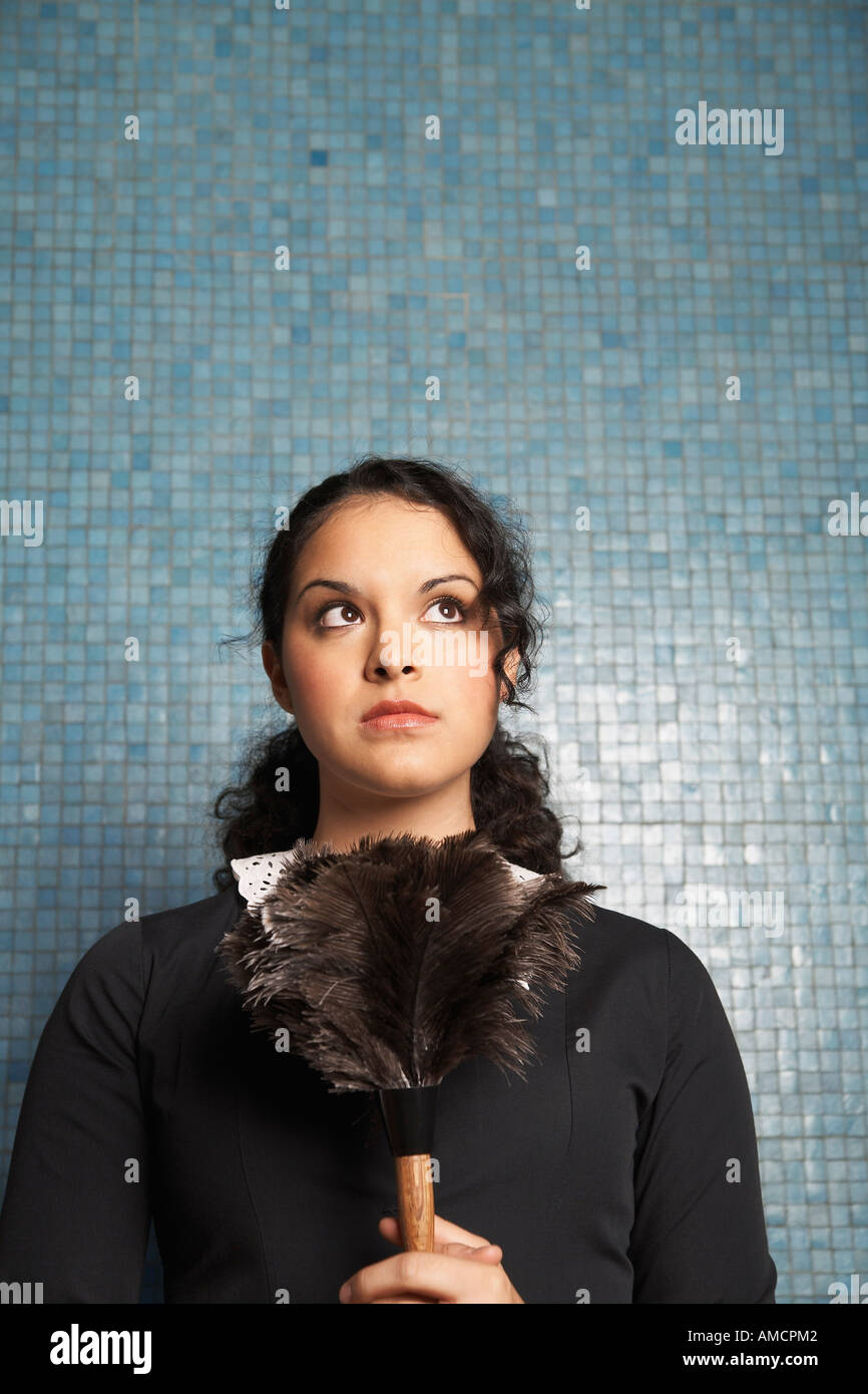 Maid Holding Duster Stock Photo - Alamy