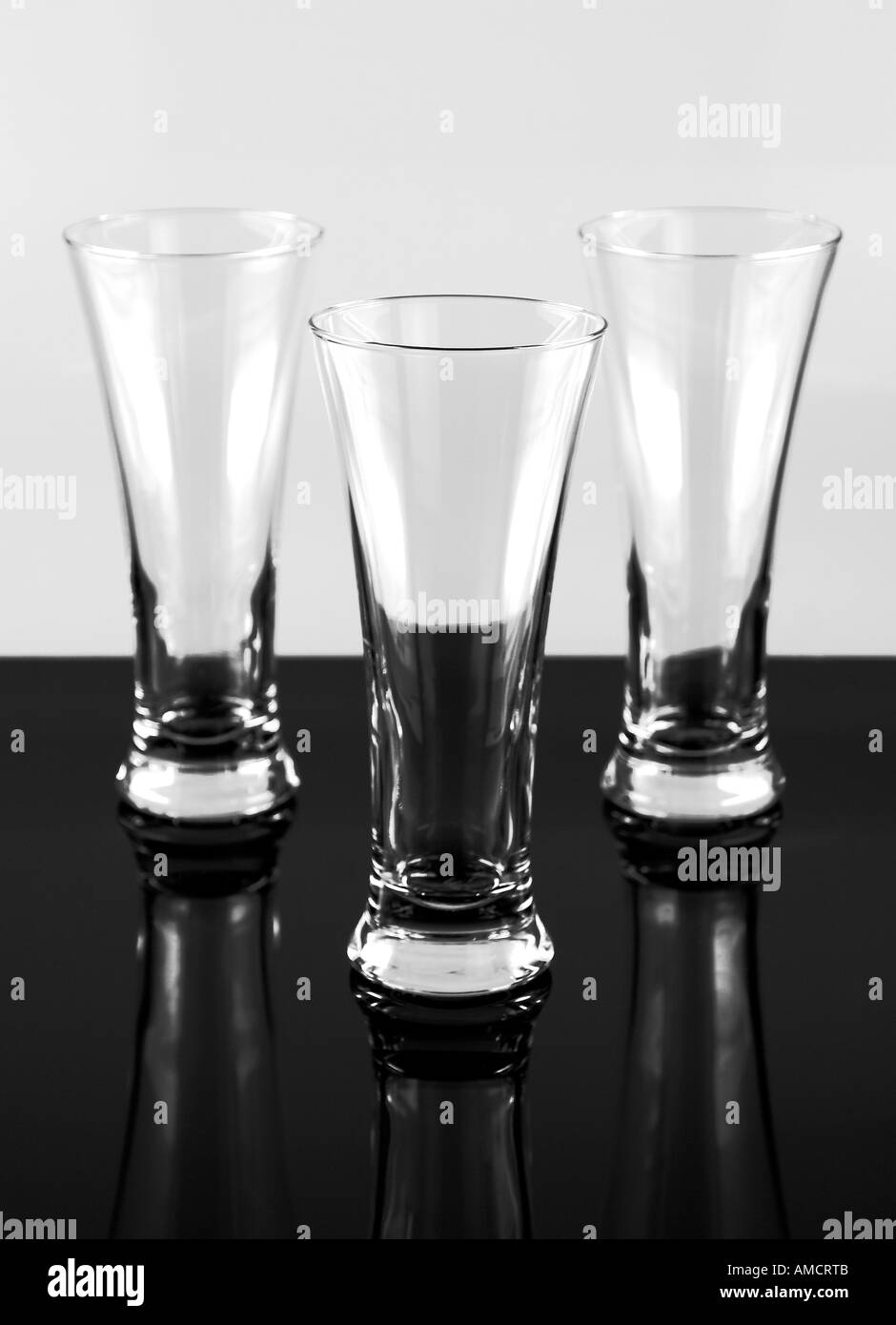 Three empty glasses Black and White Stock Photos & Images - Alamy