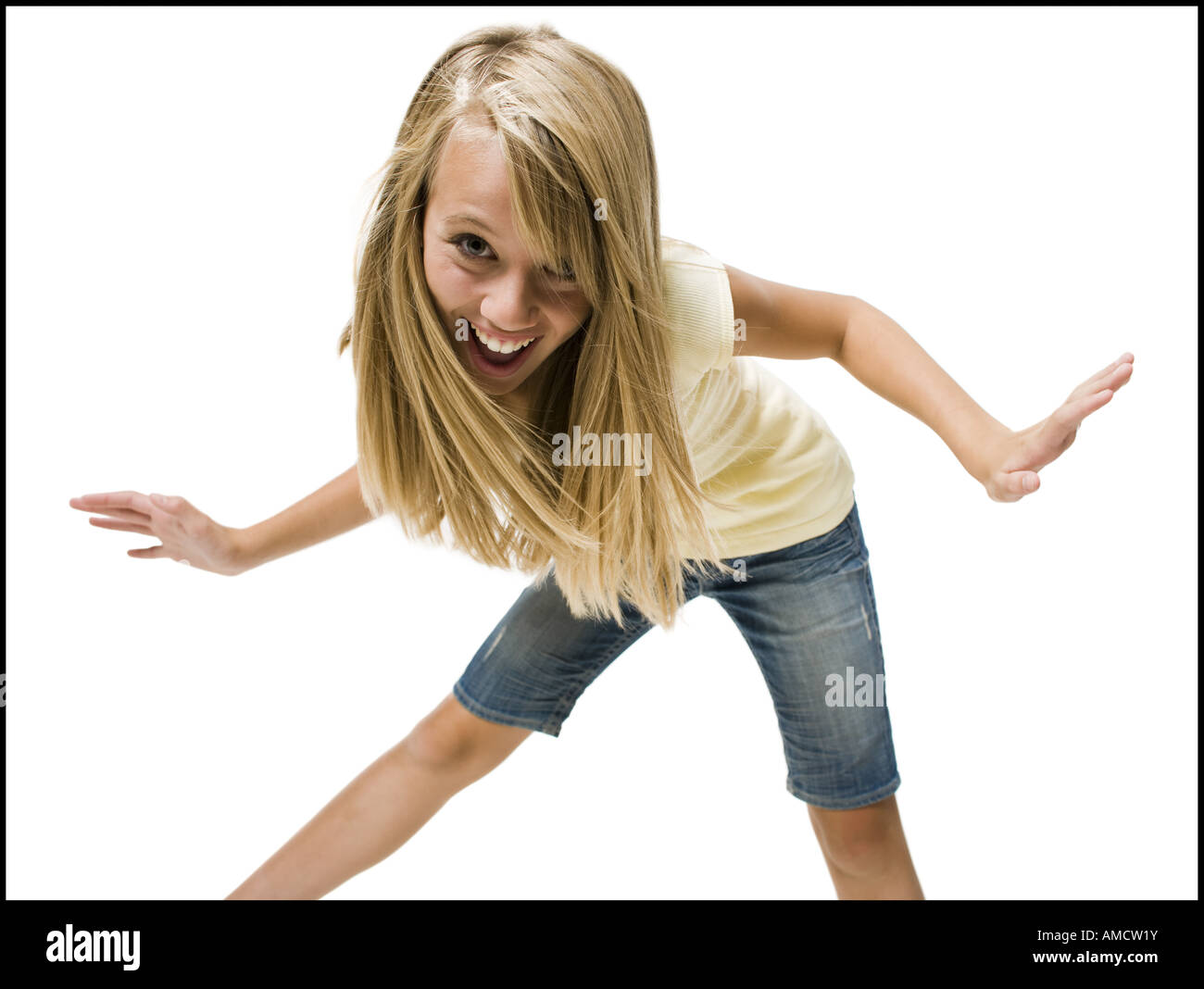 Girl dancing with arms up smiling Stock Photo - Alamy