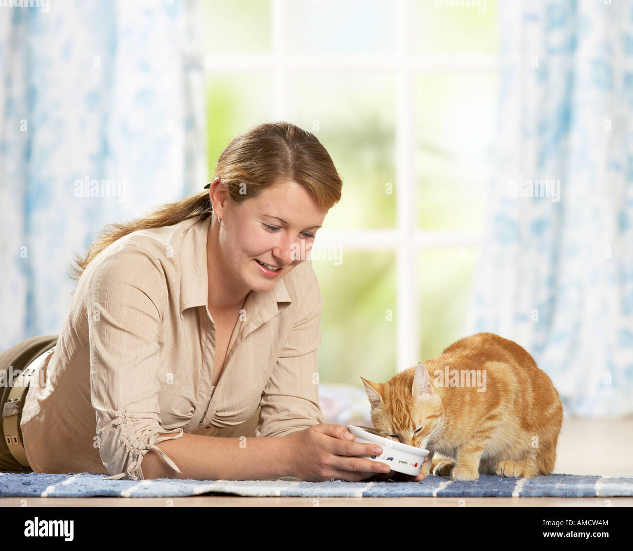 Woman cat eating hi-res stock photography and images - Alamy