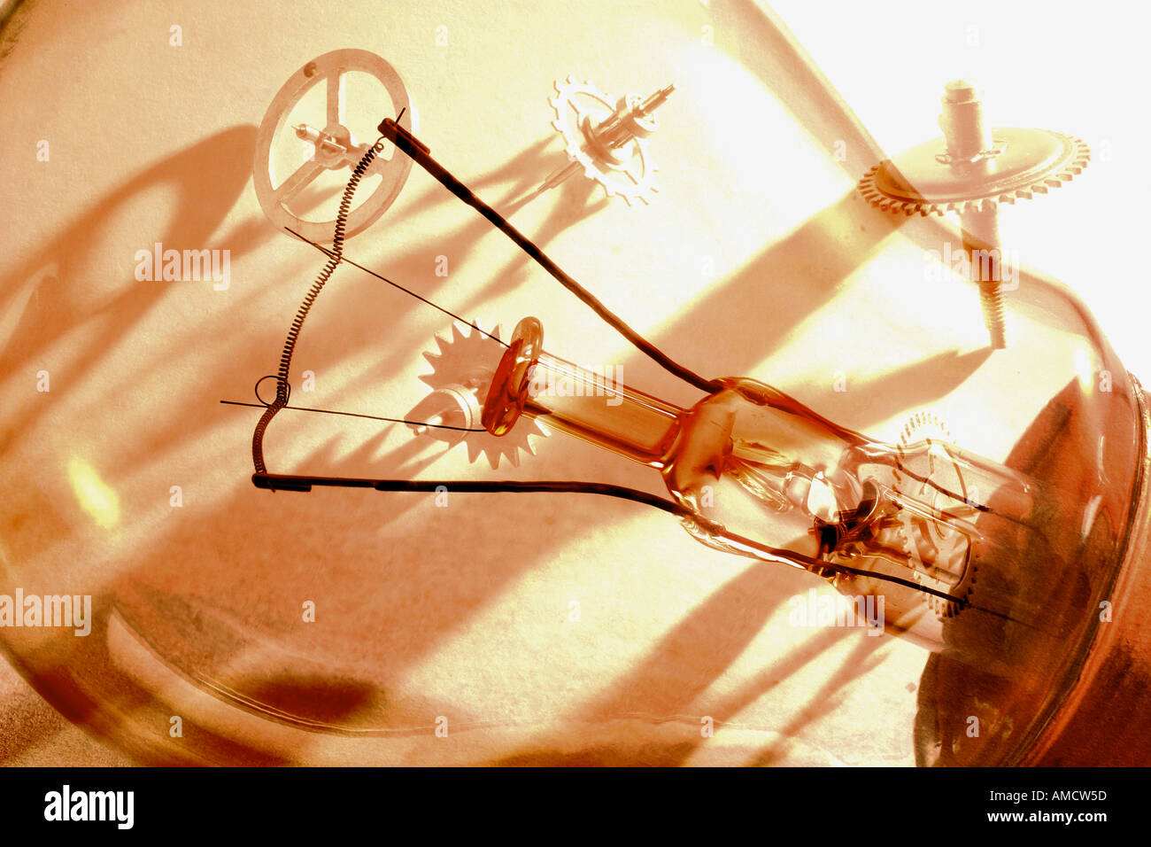 Light Bulb and Clock Cogs Stock Photo - Alamy