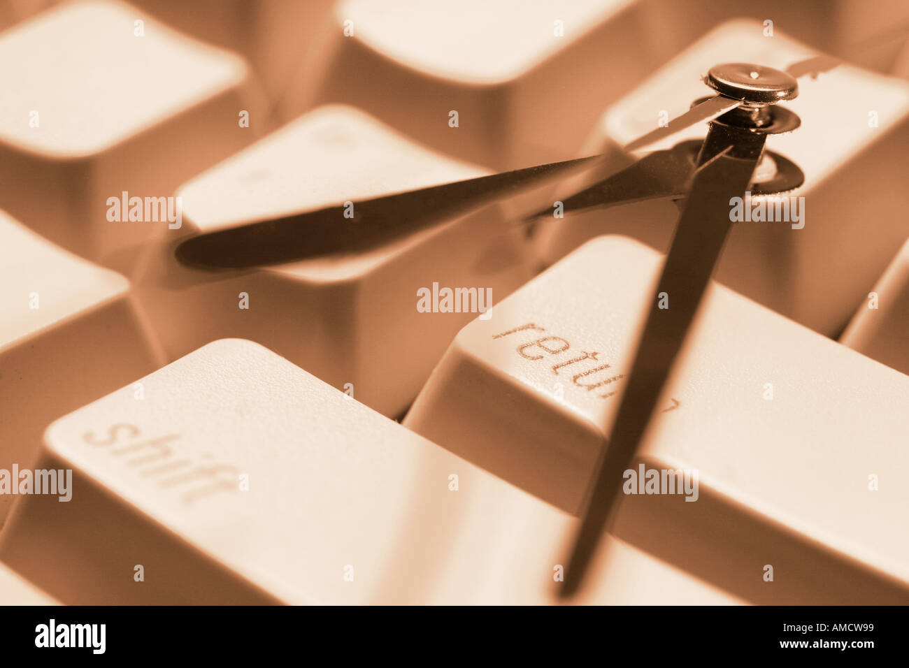 Computer Keyboard and Clock Hands Stock Photo - Alamy