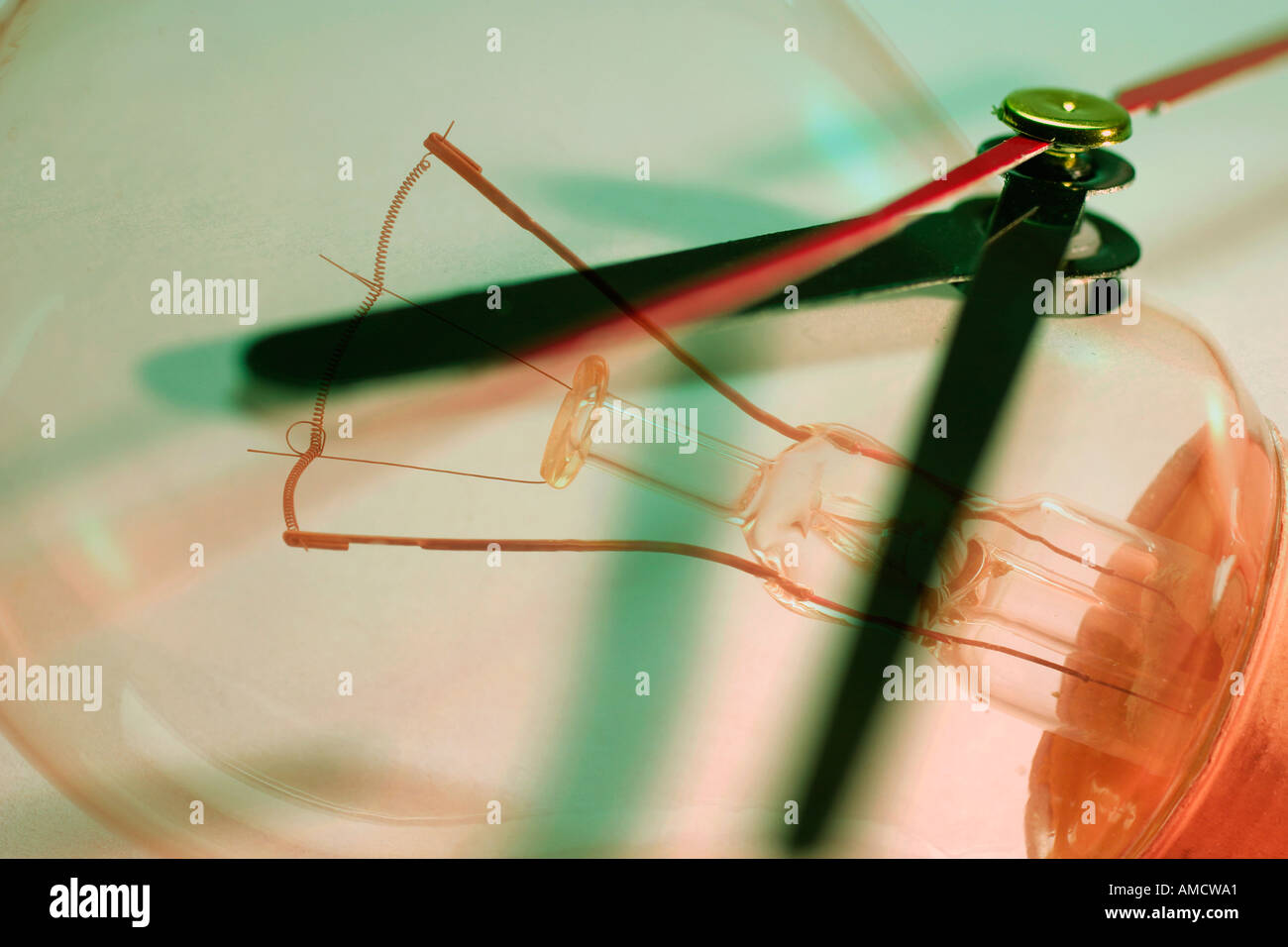 Clock Hands and Light Bulb Stock Photo - Alamy