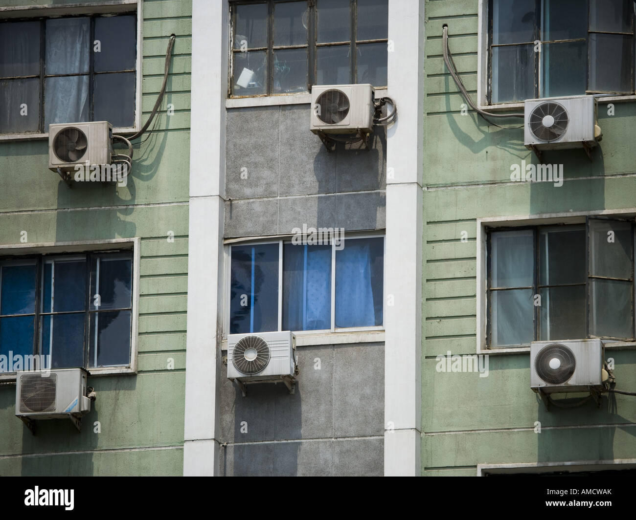 Detailed view of windows in apartment building with air conditioning ...
