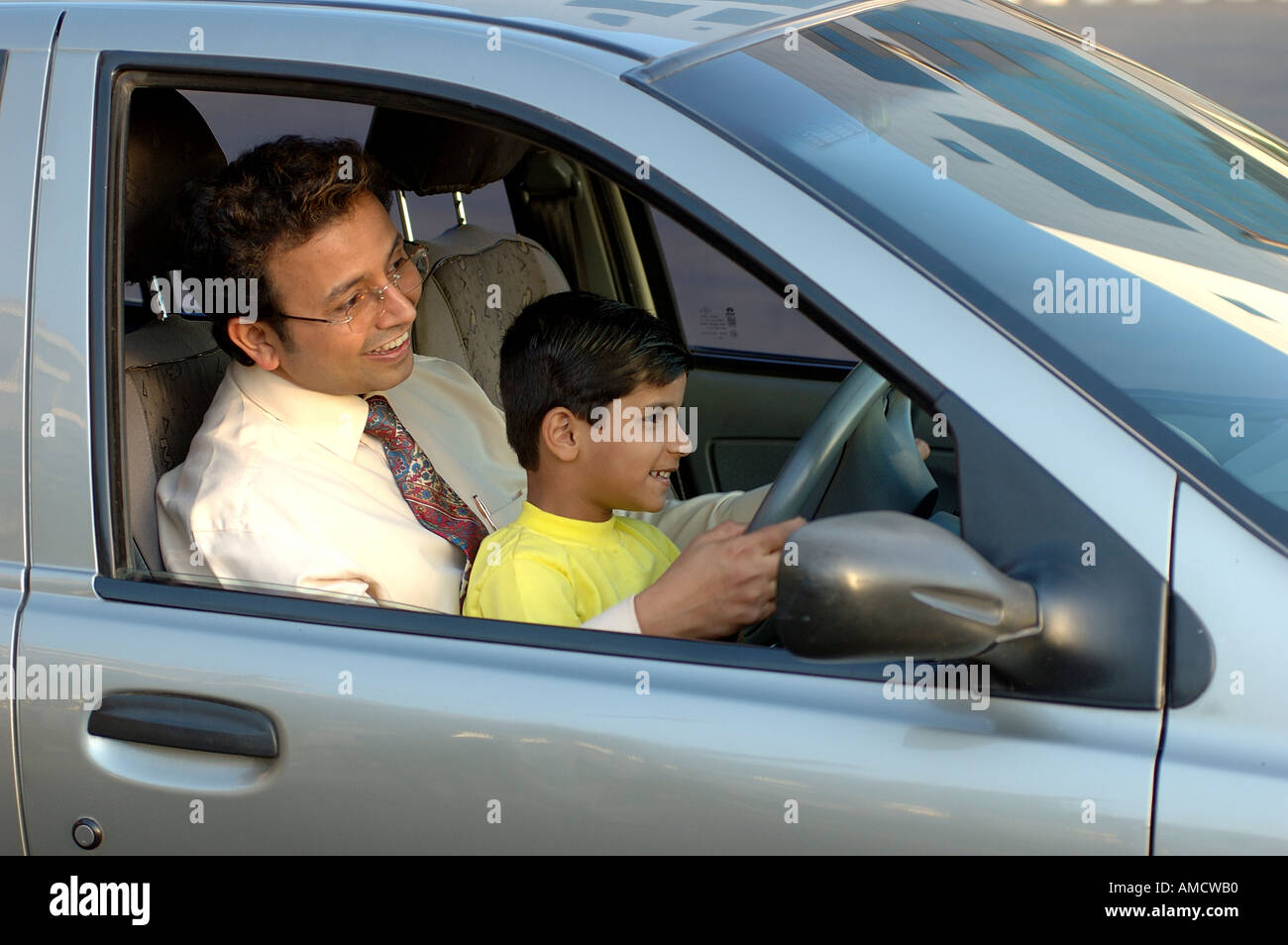 Father And Teenage Son Driving