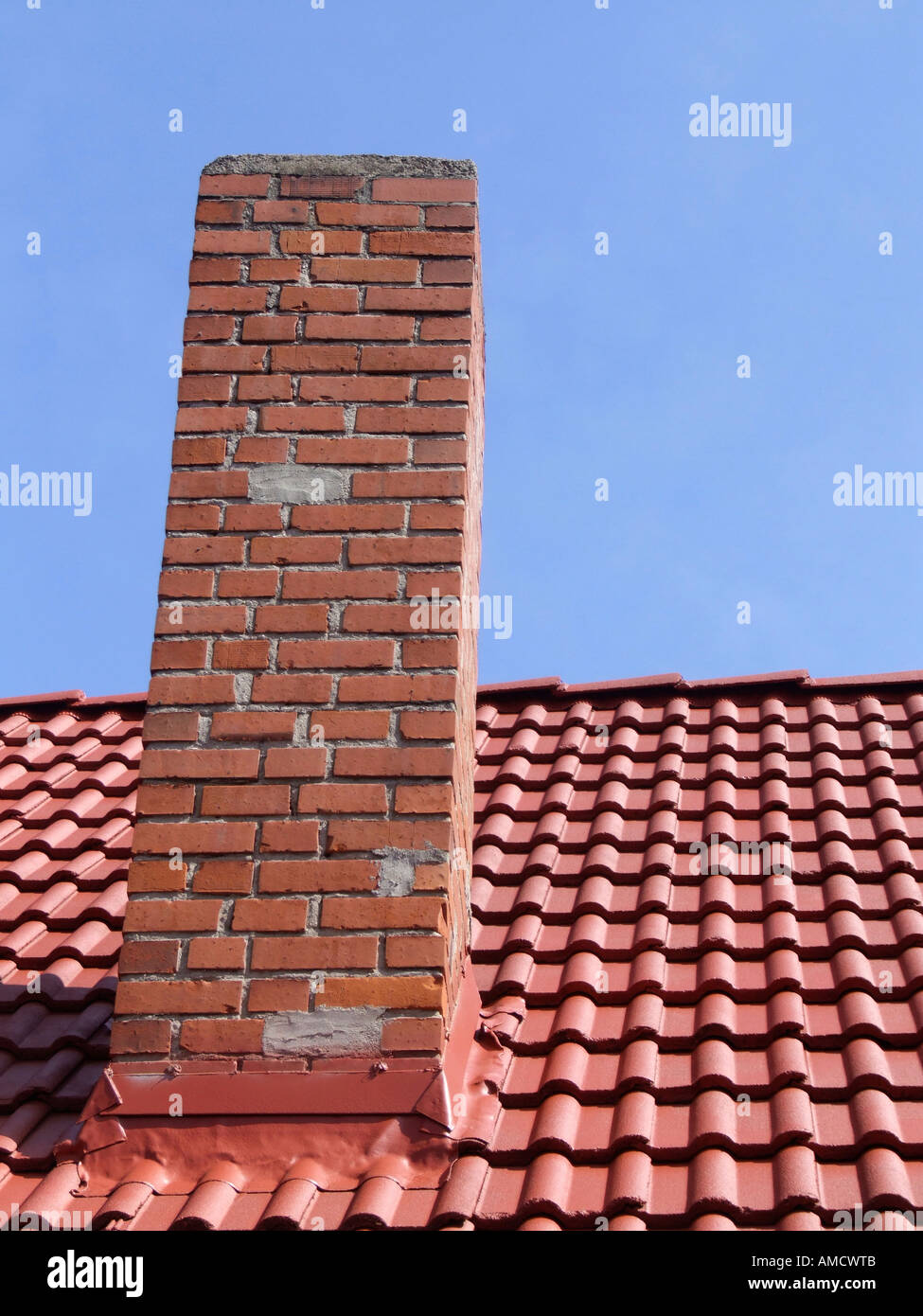 Chimney on rooftop low angle view Stock Photo - Alamy