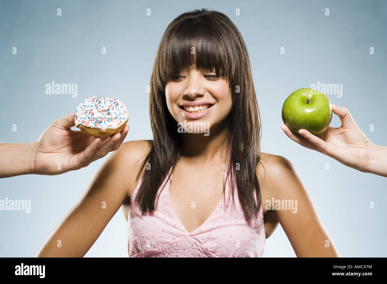 Woman choosing between foods hi-res stock photography and images - Alamy