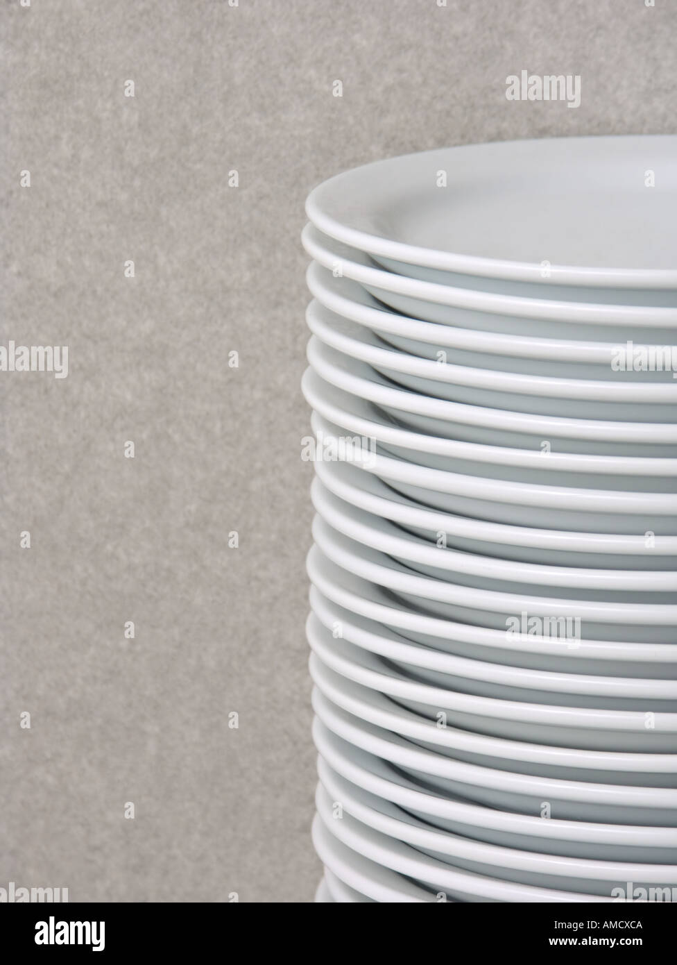 Stack of round white dinner plates Stock Photo - Alamy