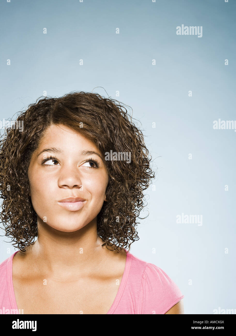 Closeup of girl thinking Stock Photo - Alamy