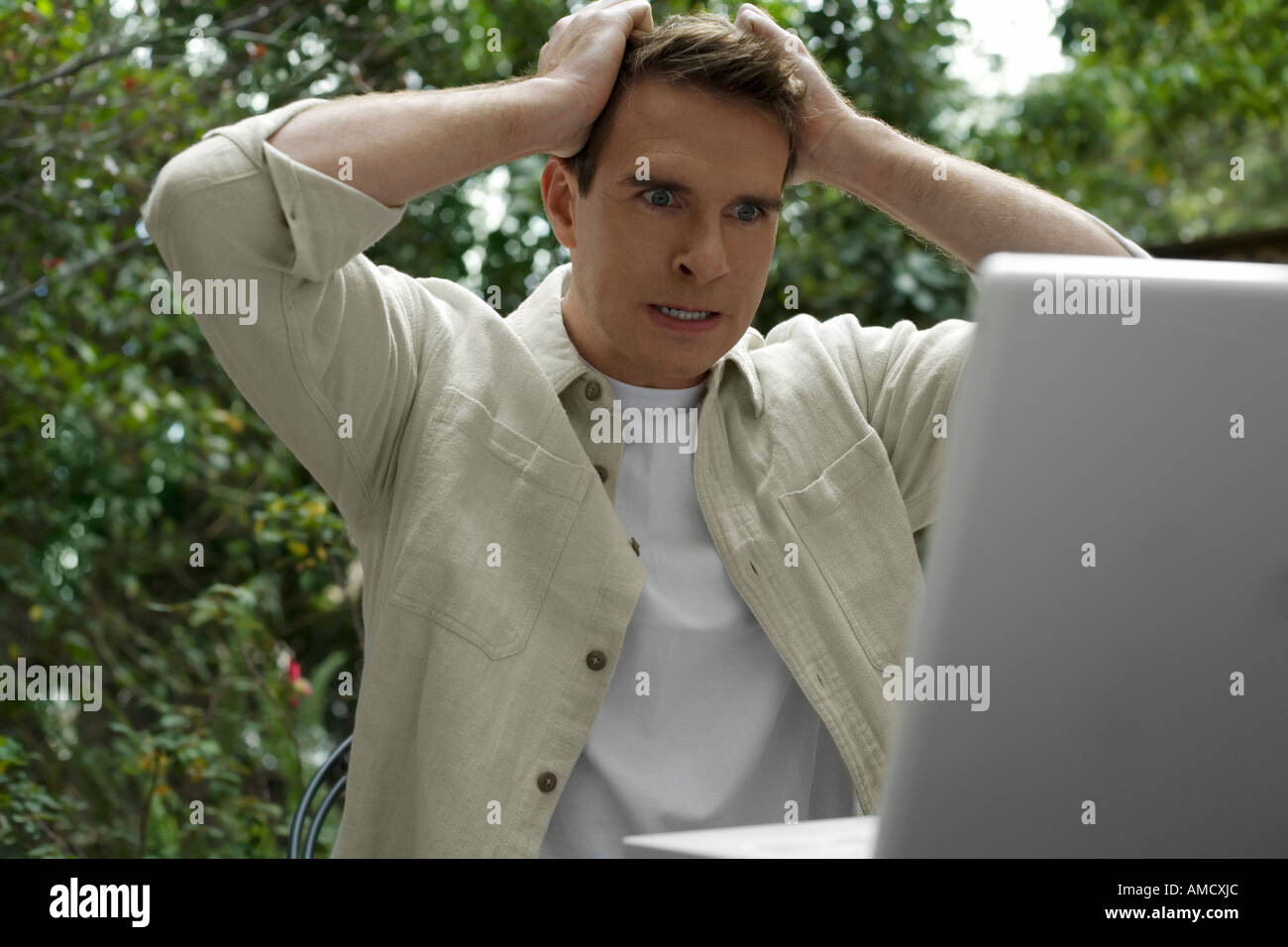 Man Sitting Outside With Laptop Computer Stock Photo - Alamy