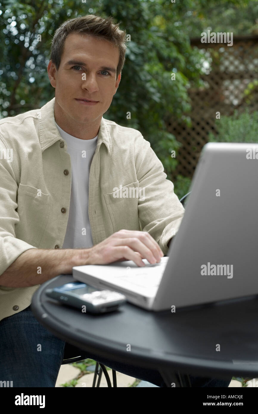 Man Sitting Outside With Laptop Computer Stock Photo - Alamy