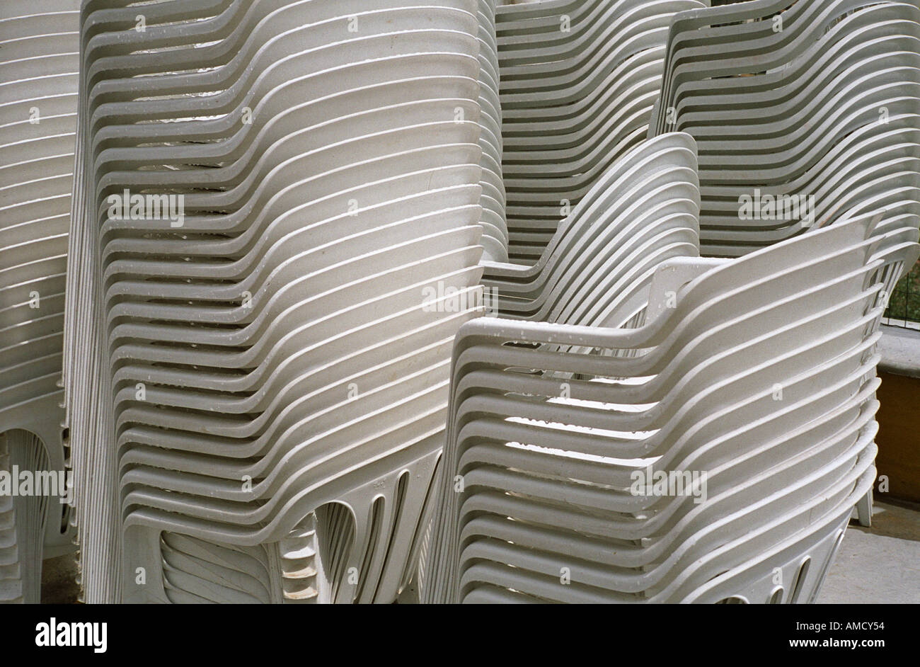 stacks of garden chairs Stock Photo - Alamy