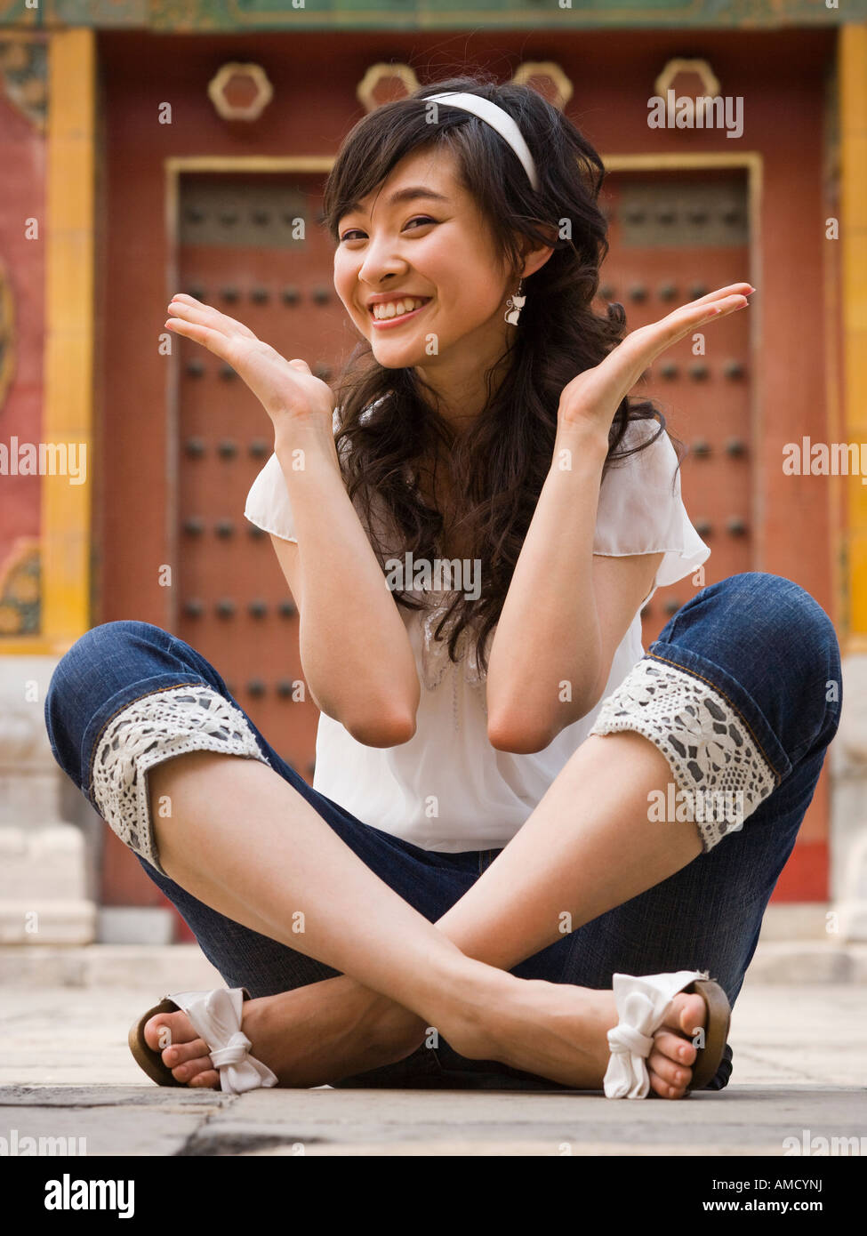 Teenage girl sitting crossed legged hi-res stock photography and images ...