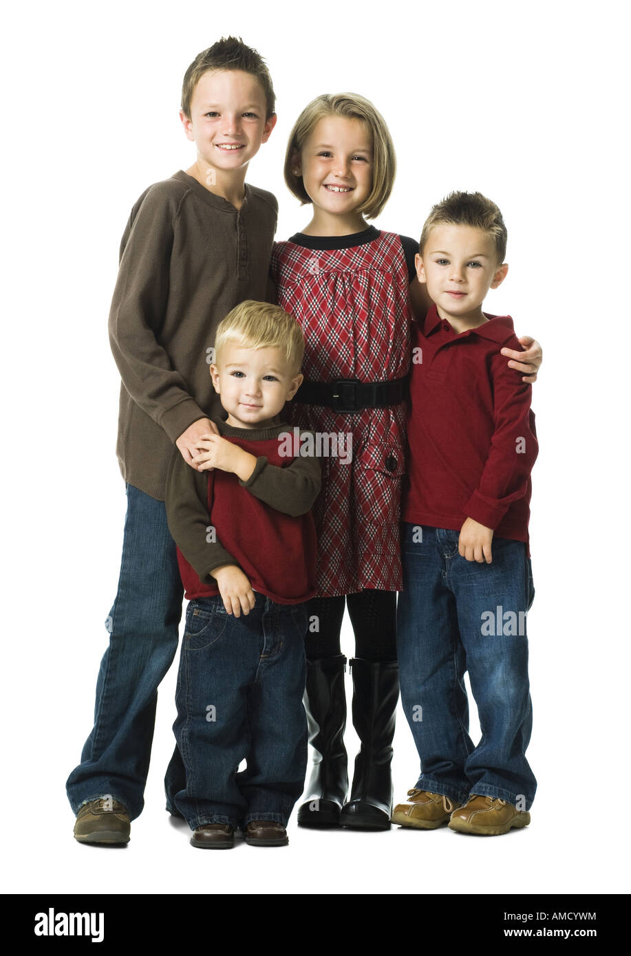 Four children posing and smiling Stock Photo - Alamy