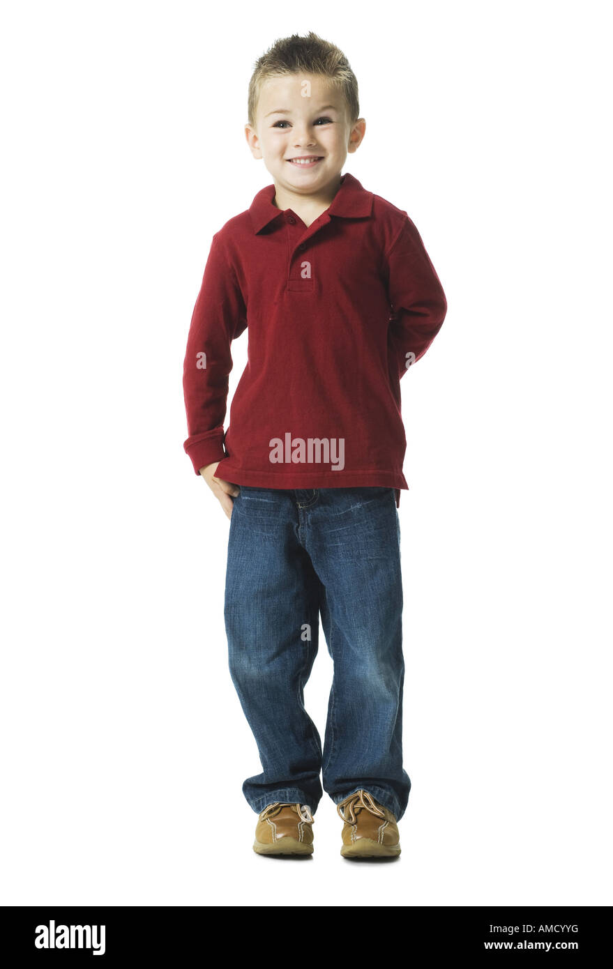 Boy standing and smiling Stock Photo - Alamy