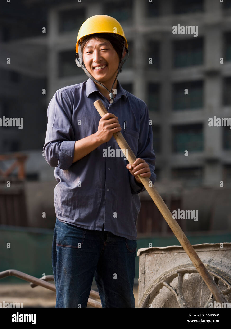Construction worker outdoors with helmet smiling Stock Photo - Alamy