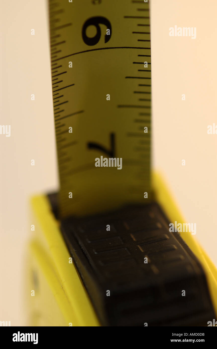 Measuring tape yellow color clean background Stock Photo - Alamy