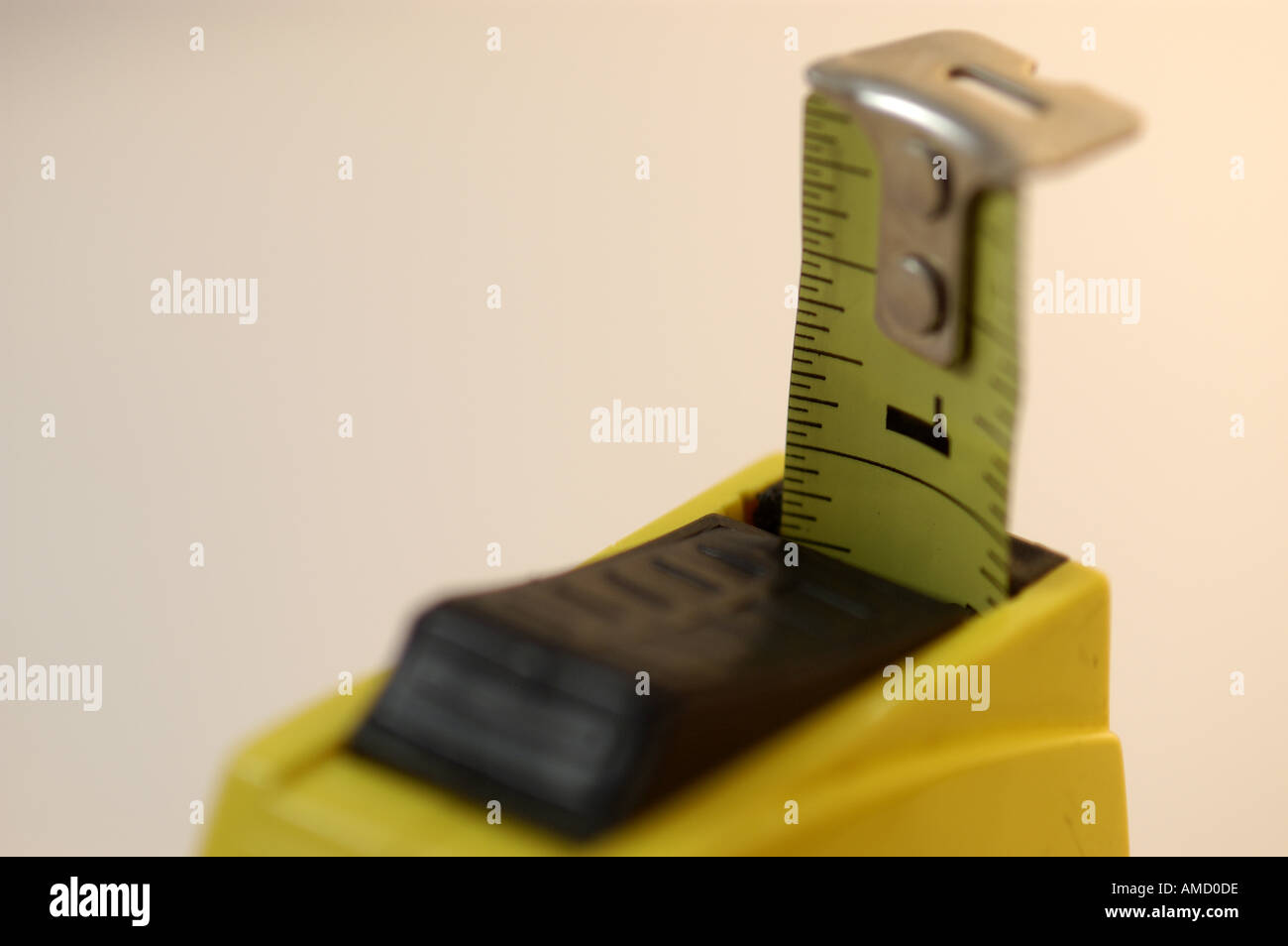 Measuring tape yellow color clean background Stock Photo - Alamy