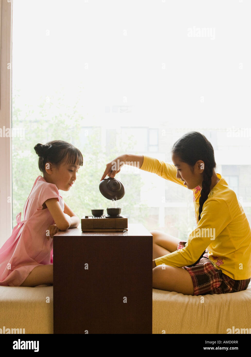 Two children having tea party hi-res stock photography and images - Alamy