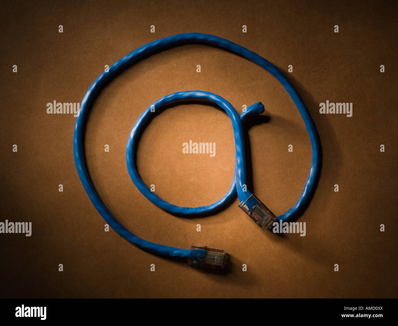 Computer cable forming at sign Stock Photo - Alamy