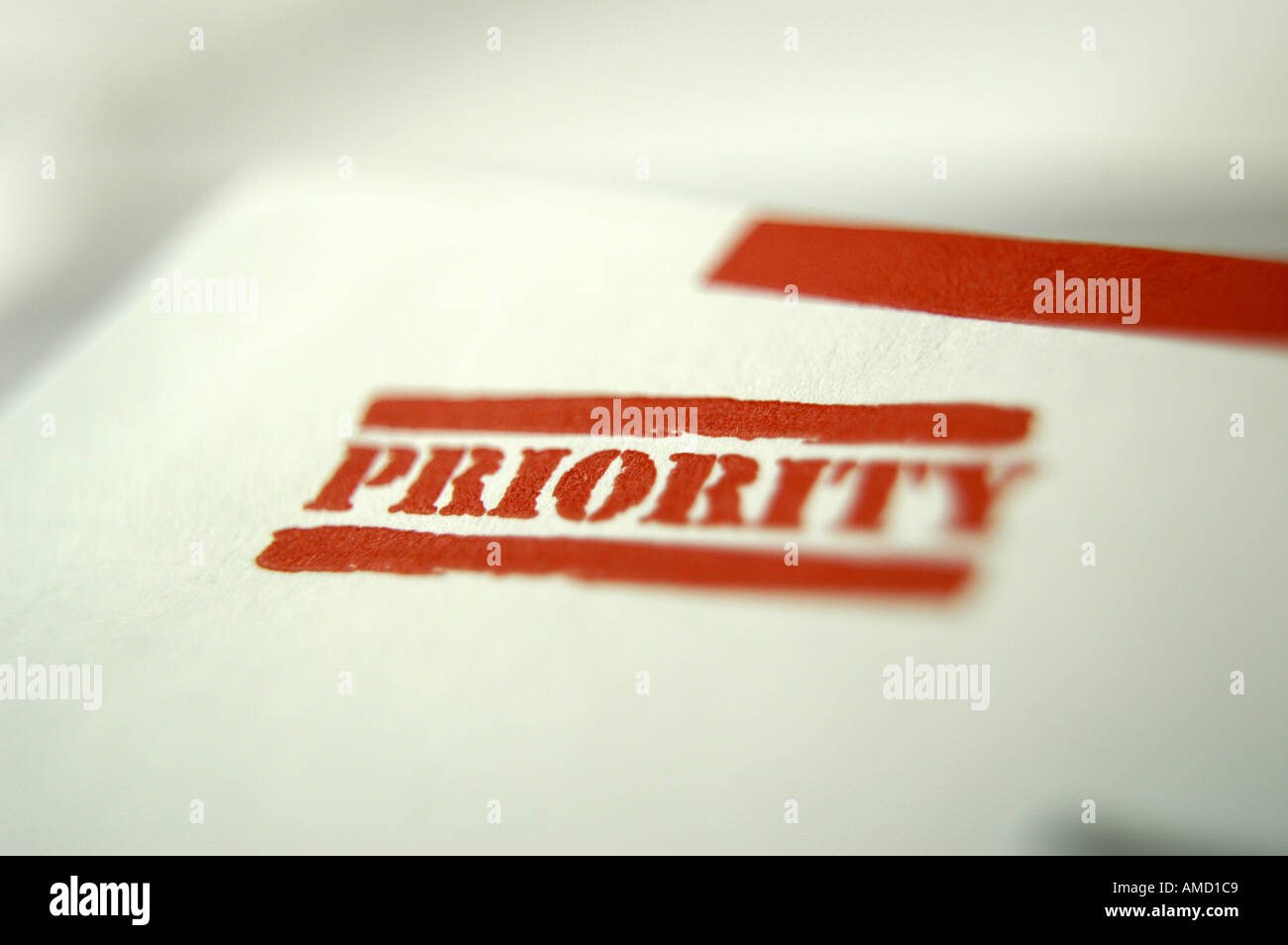 Priority red stamp on form Stock Photo - Alamy