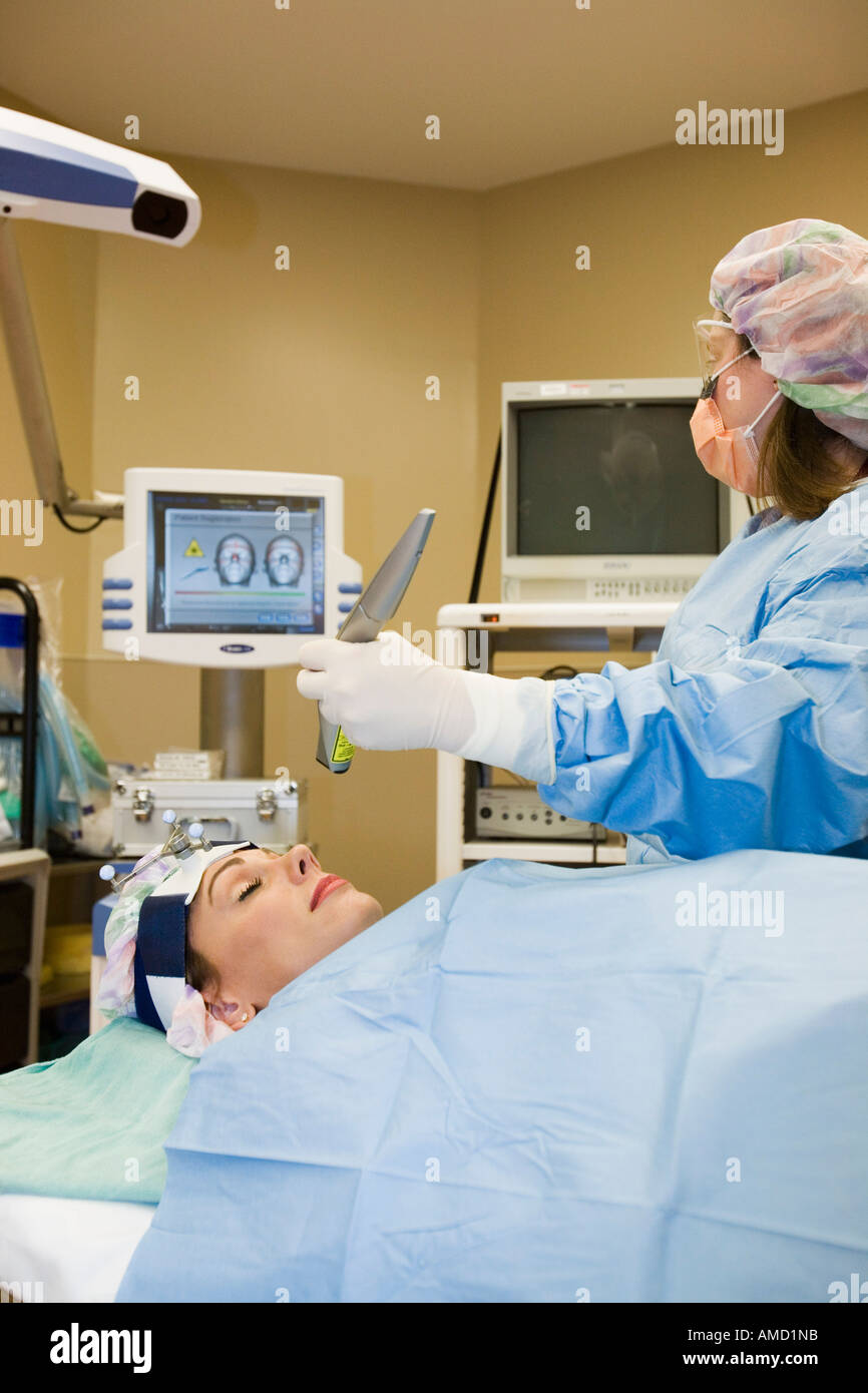 Female physician checking her watch High Resolution Stock Photography ...