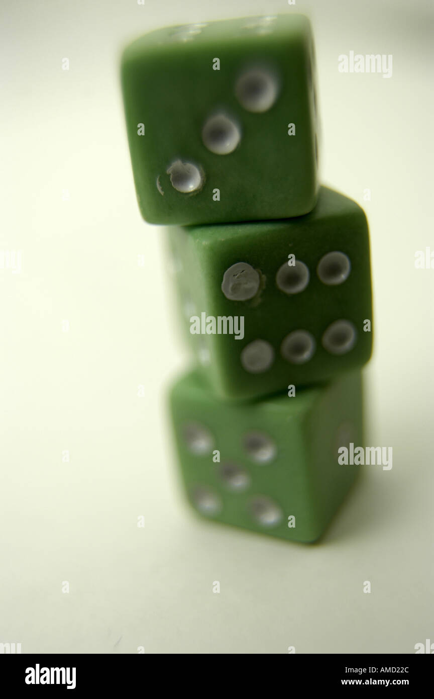 Three green dice stacked side view VERTICAL Stock Photo - Alamy