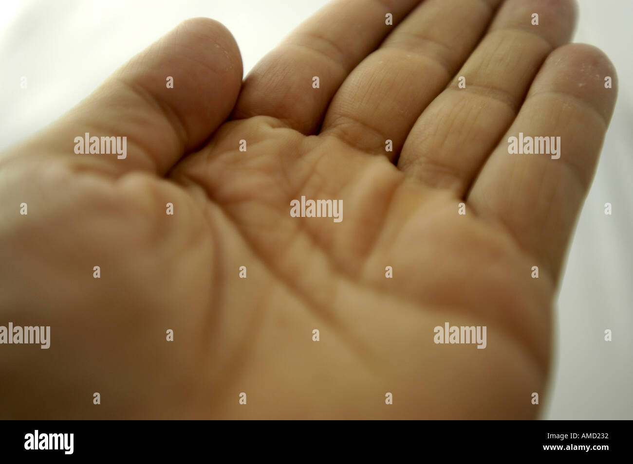 Extended left hand palm Stock Photo - Alamy