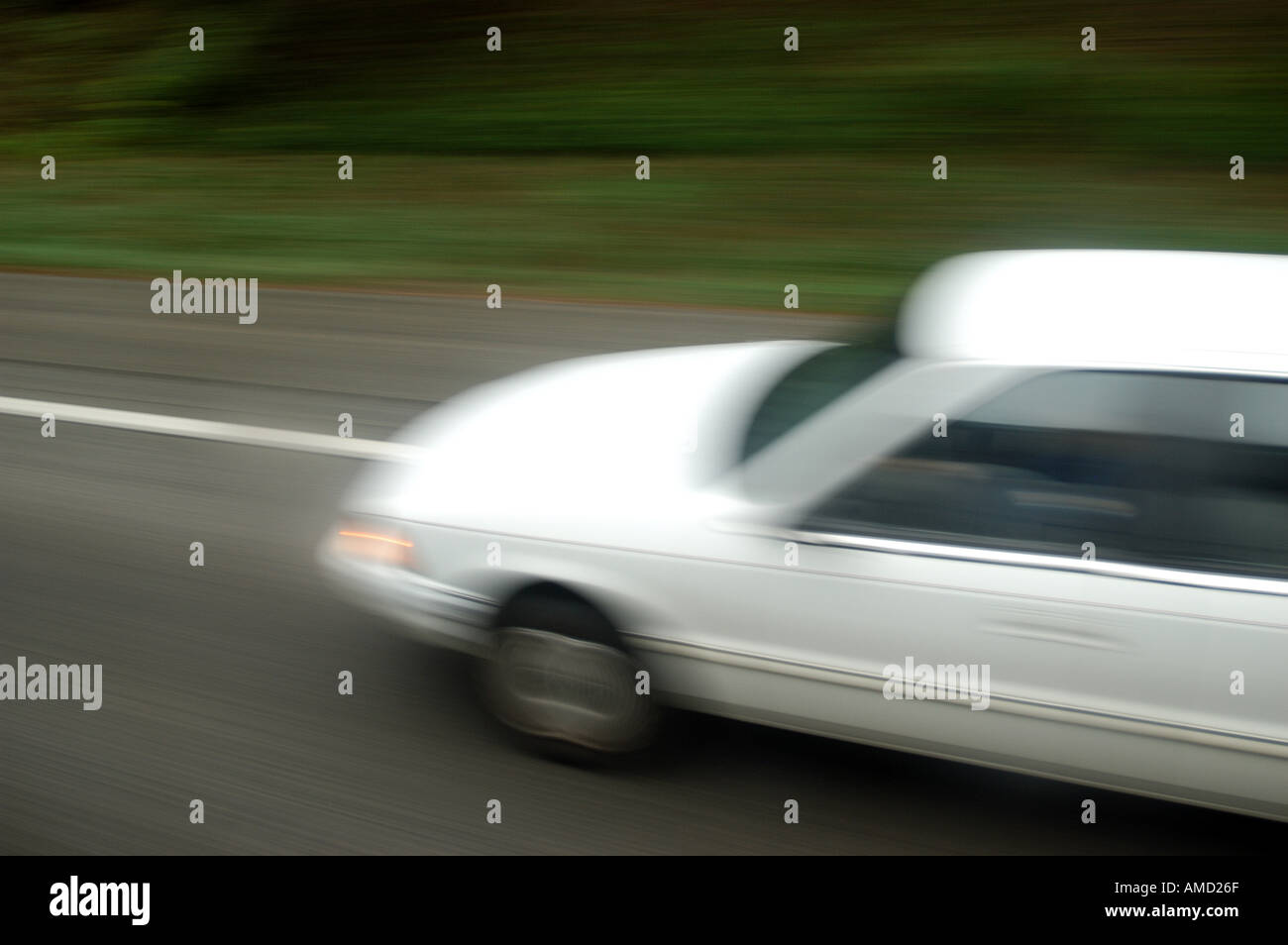 White sedan car on highway on high speed Stock Photo - Alamy