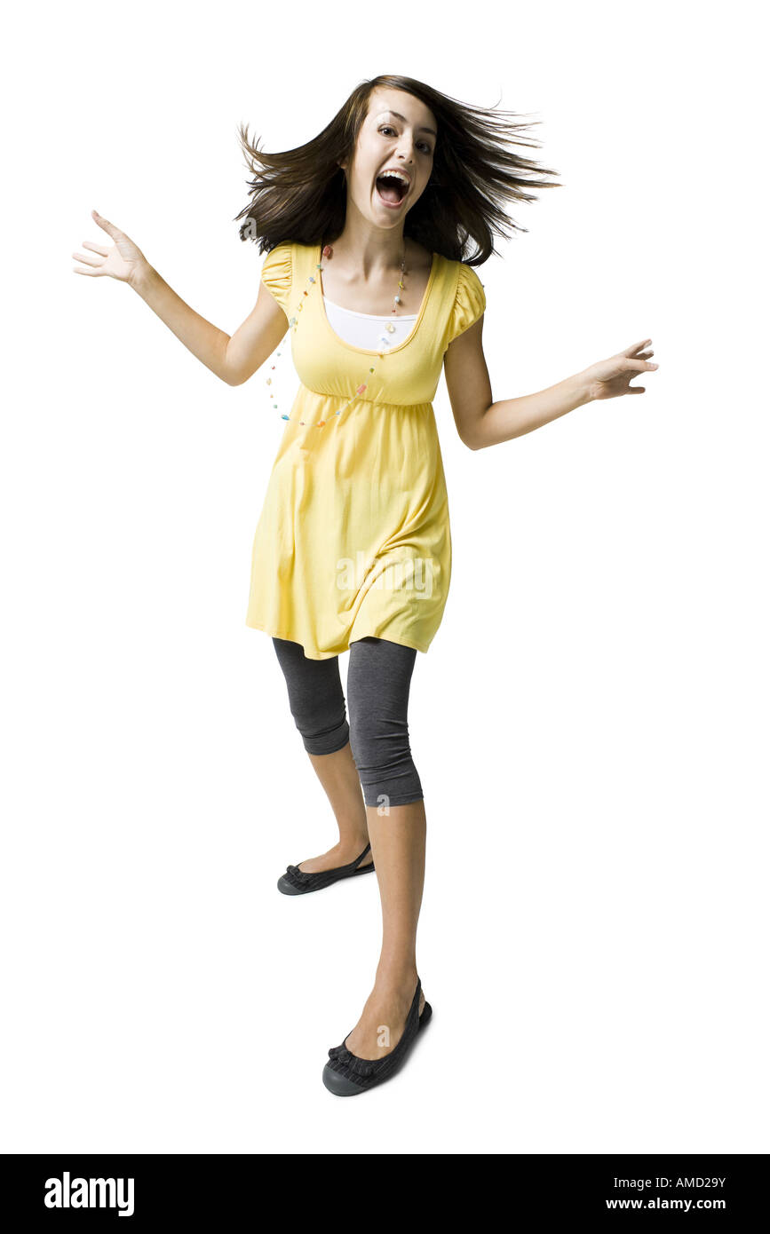 Teenage girl dancing and smiling Stock Photo - Alamy