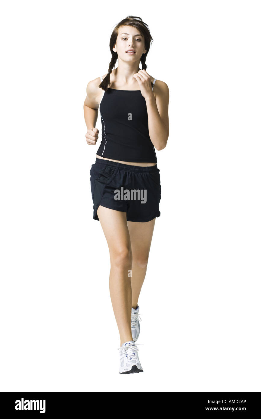 Teenage girl jogging Stock Photo - Alamy