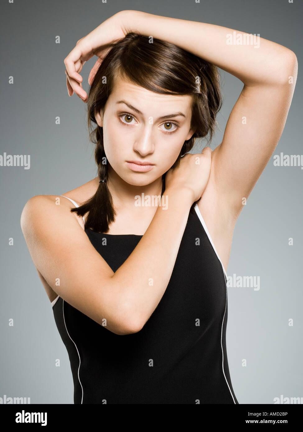 Teenage girl stretching arms Stock Photo - Alamy