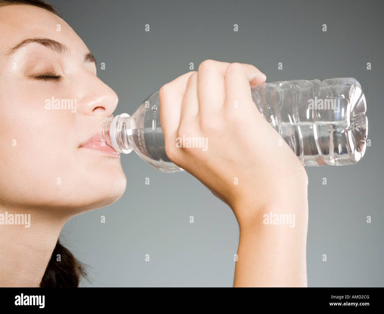 Teenage girl drinking bottled water Stock Photo - Alamy