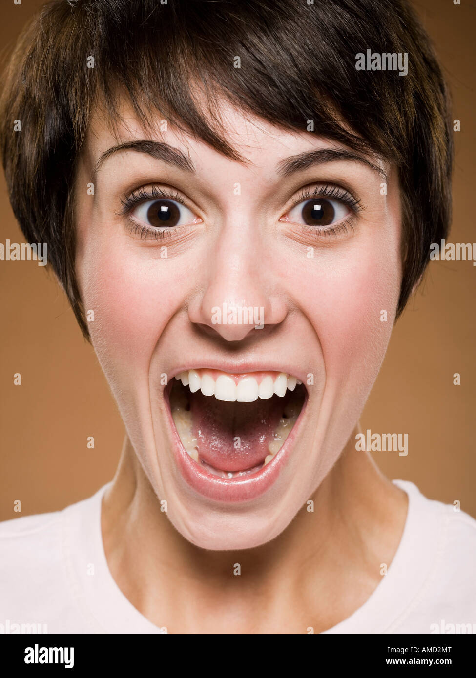 Woman with mouth open excitedly Stock Photo - Alamy